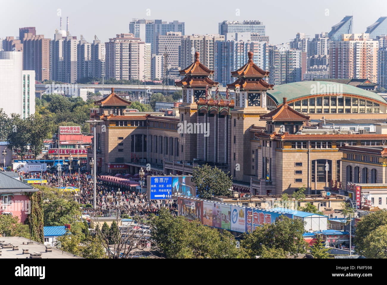 A Lot of people on the square in front of the Beijing Railway Station ...