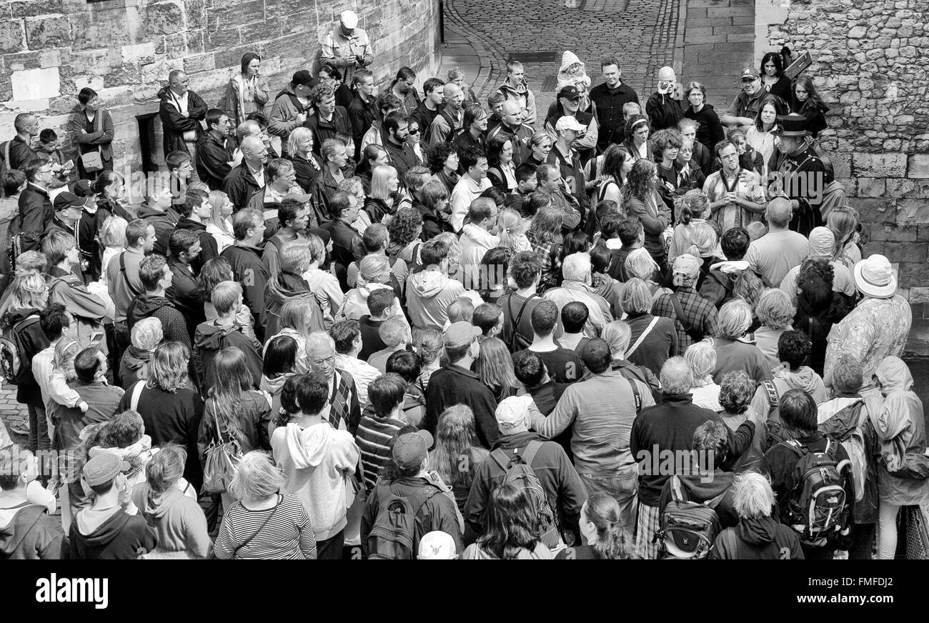Beefeater / yeoman of the guard addresses multi cultural crowd of ...
