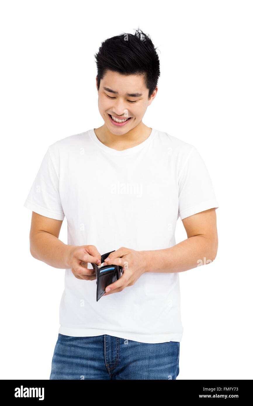 Happy young man holding wallet Stock Photo - Alamy