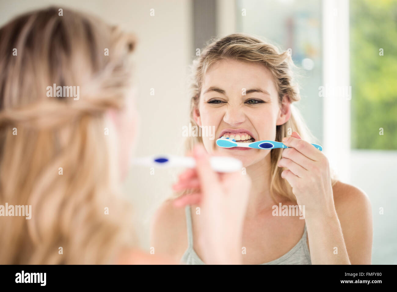 Woman brushing teeth Stock Photo - Alamy