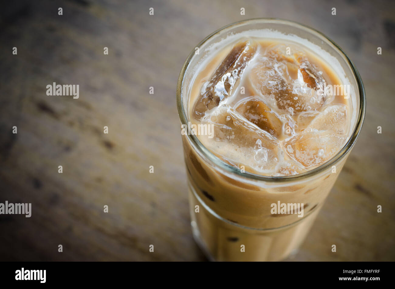 Glass Of Cold Coffee On Wood Table Stock Photo - Alamy