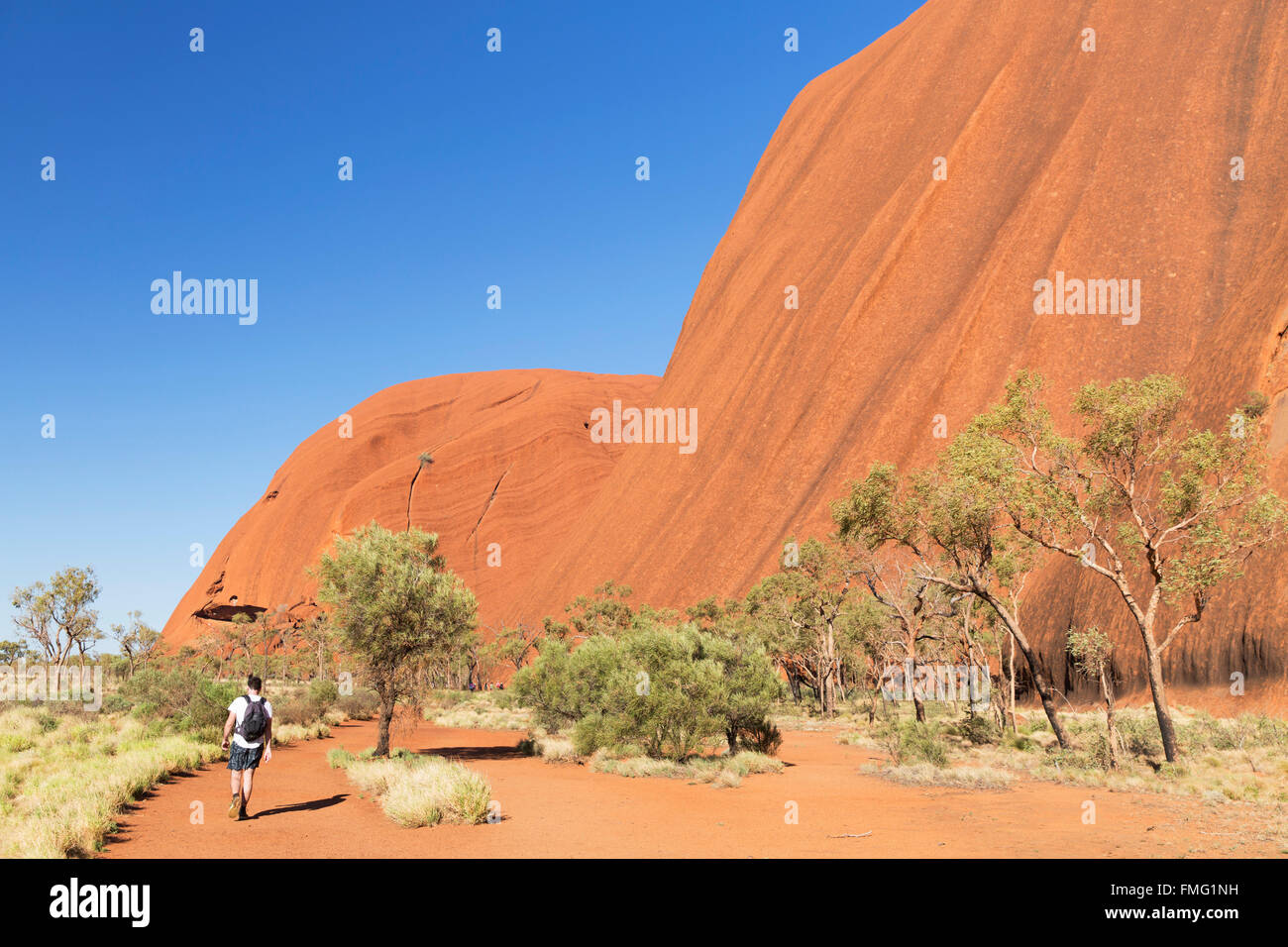 Tourist at Uluru (UNESCO World Heritage Site), Uluru-Kata Tjuta ...