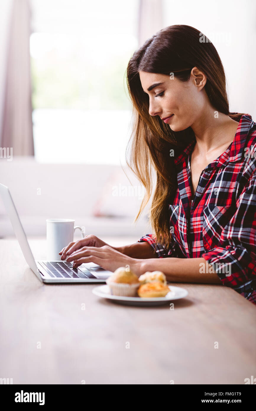 Woman typing on laptop Stock Photo - Alamy