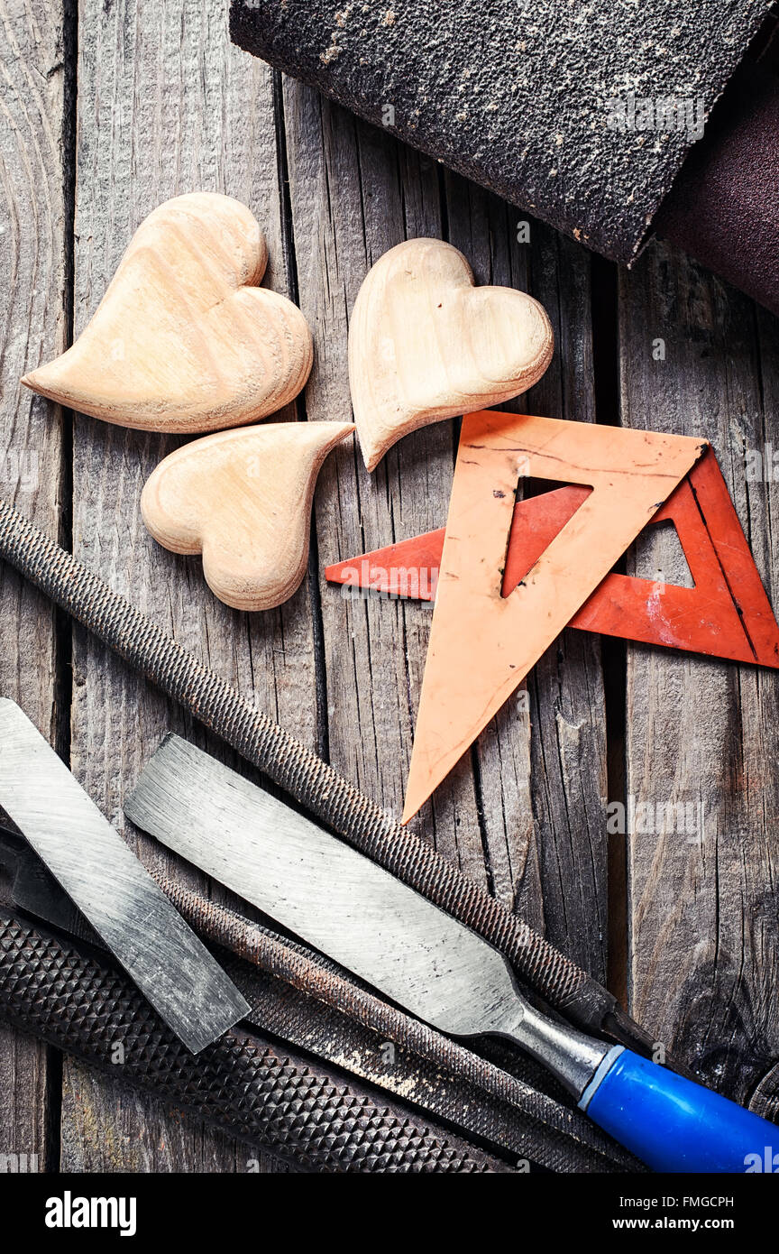 Symbolic wooden hearts cut by hand and carpenter tools Stock Photo - Alamy