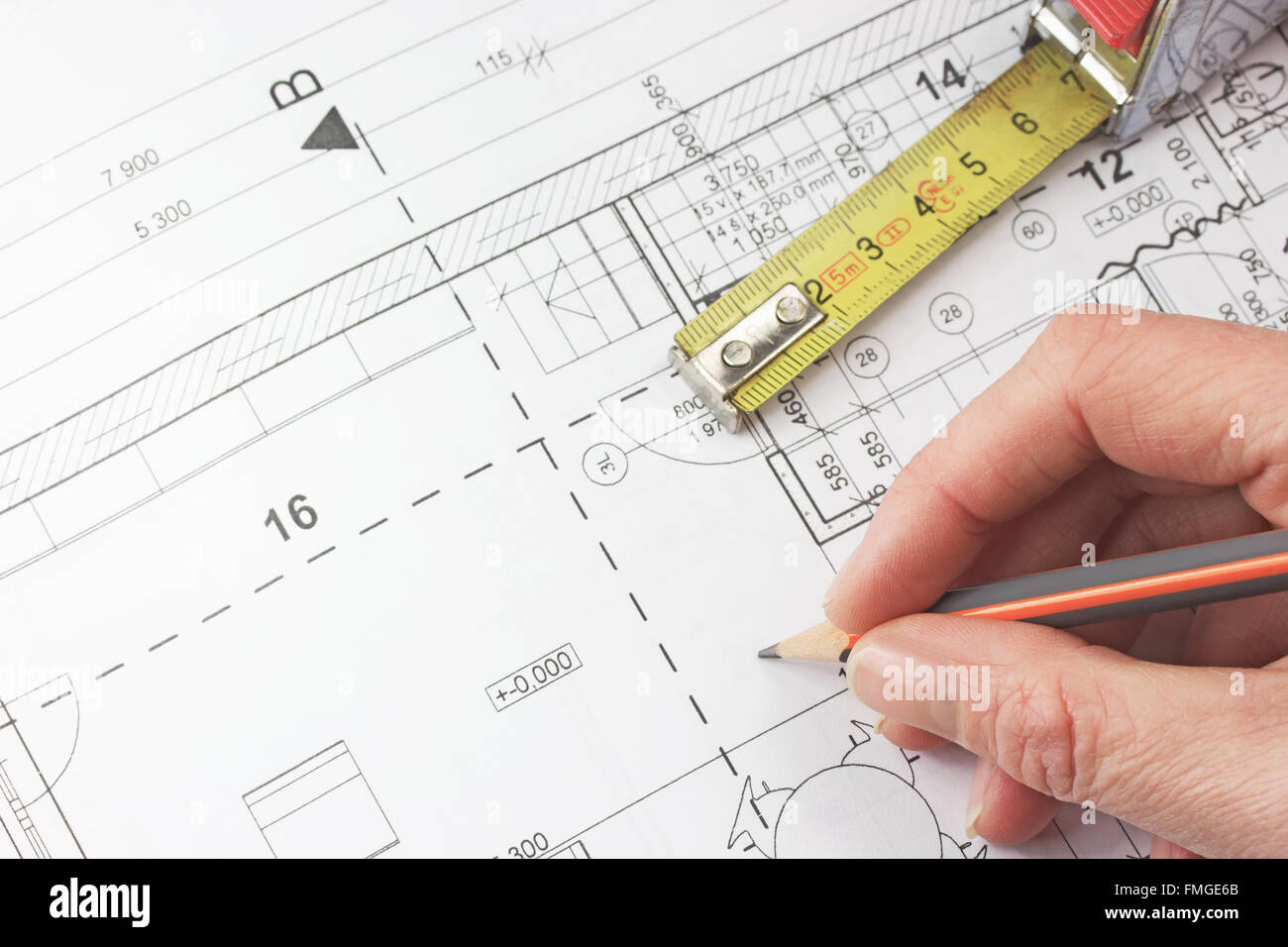 Plan of a house with a ruler and a hand writing with a pencil Stock ...