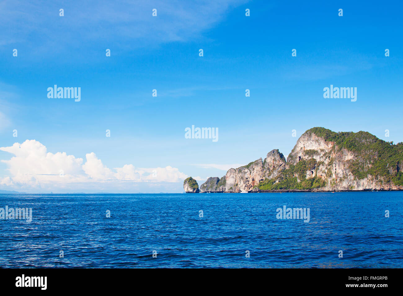 Deep blue Andaman sea view with cloudy sky and rock island on horizon ...