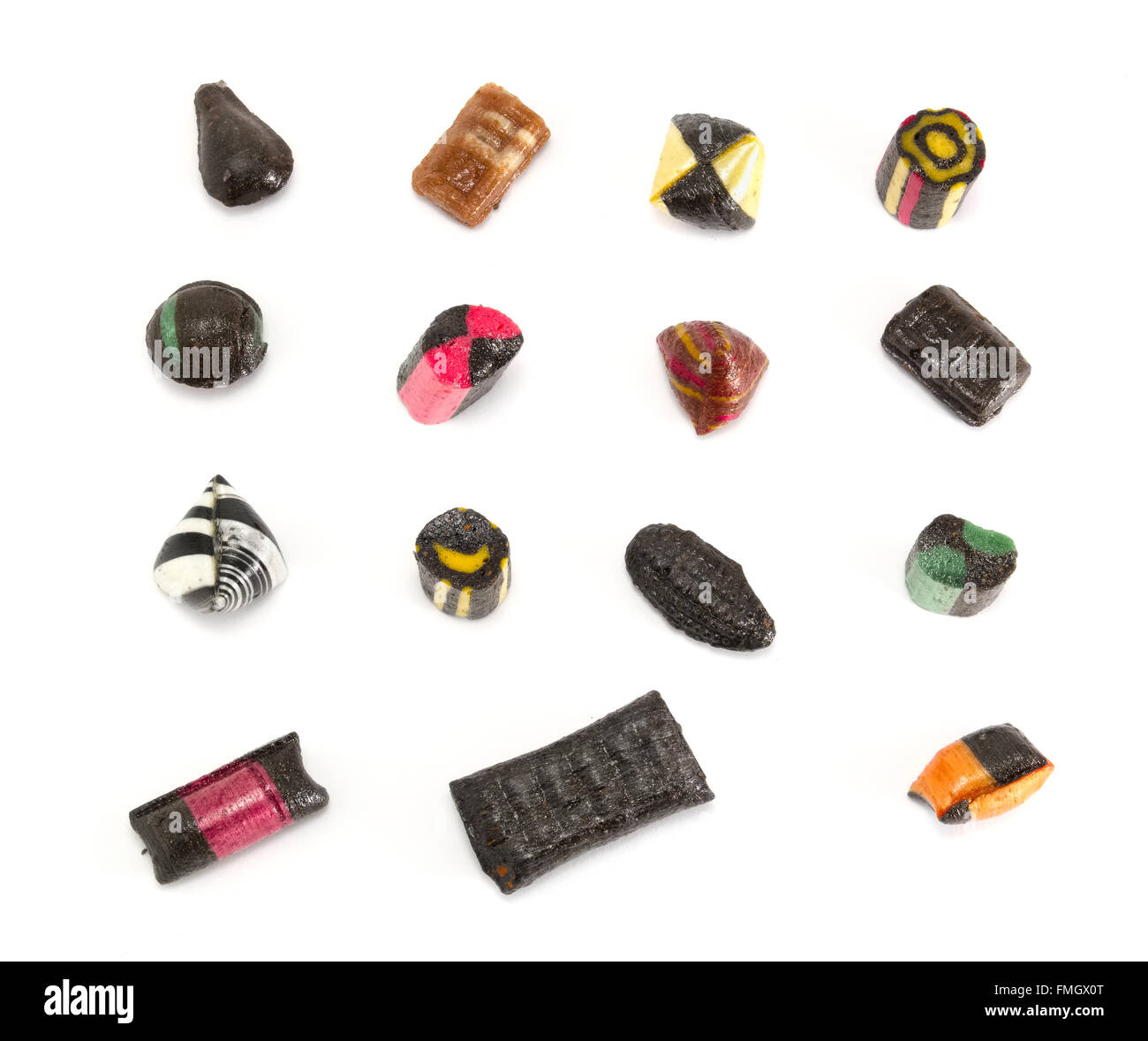 Assorted liquorice candy lying in a square pattern on a white ...