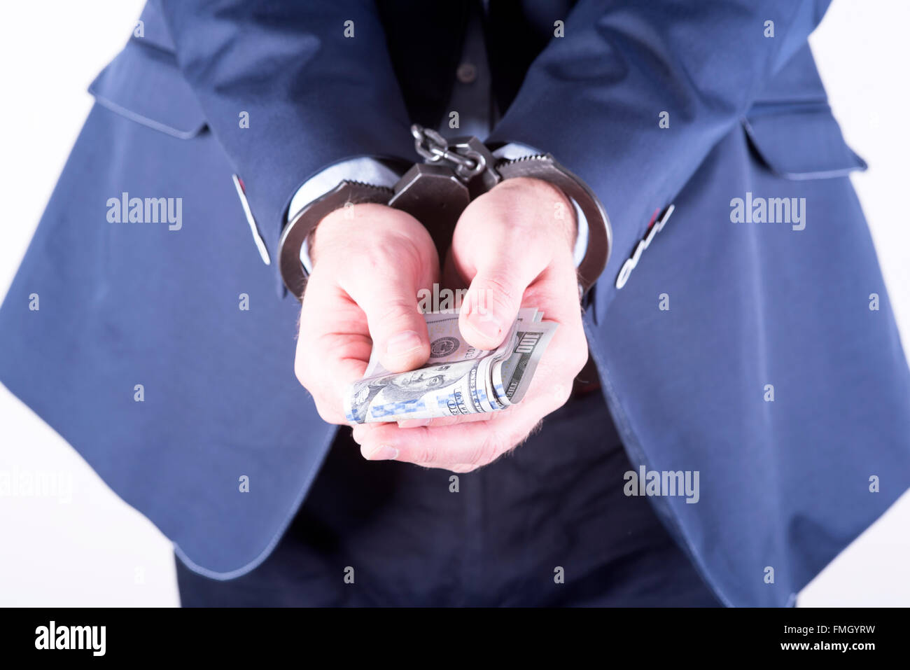 photo showing money with handcuffs Stock Photo - Alamy