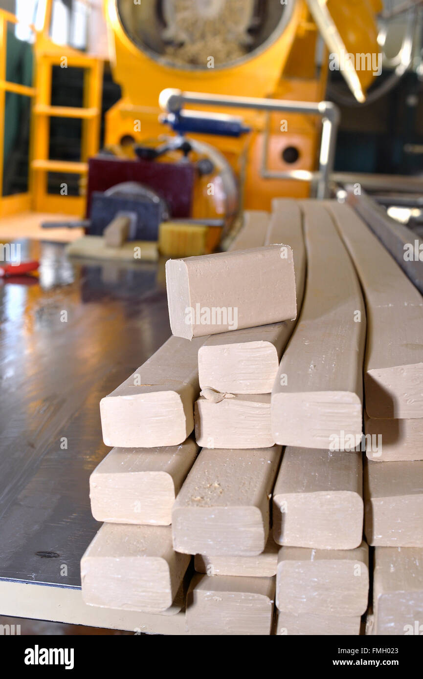 Pieces of soap on the assembly line at the plant for the production of ...