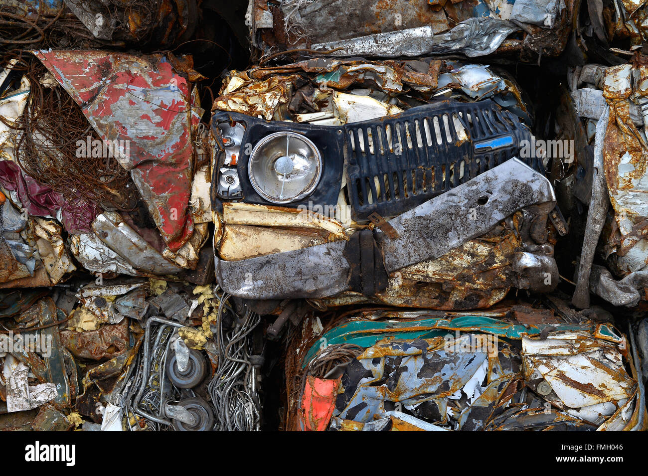 A pile of compressed cars in blocks for processing Stock Photo - Alamy