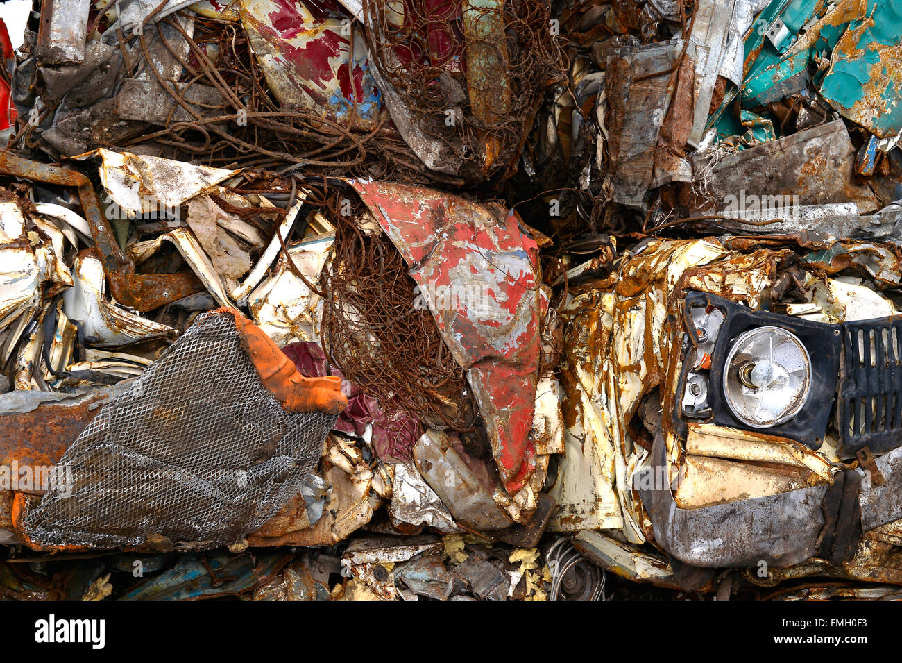 A pile of compressed cars in blocks for processing Stock Photo - Alamy