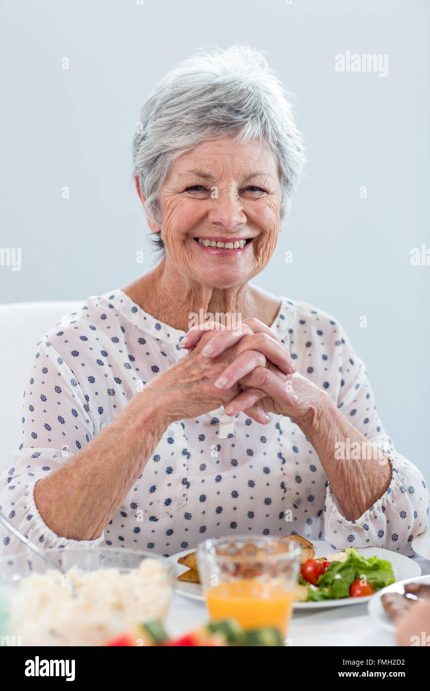 Elderly woman having breakfast Stock Photo - Alamy