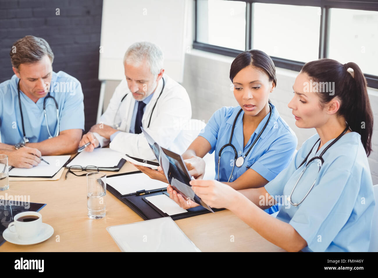 Medical team interacting in conference room Stock Photo - Alamy