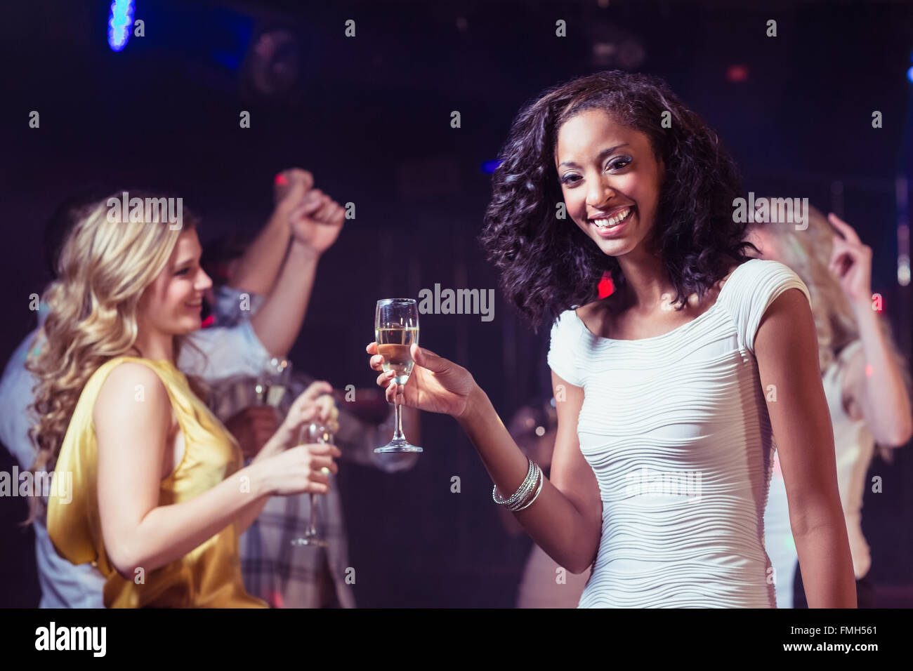 Happy friends dancing Stock Photo - Alamy