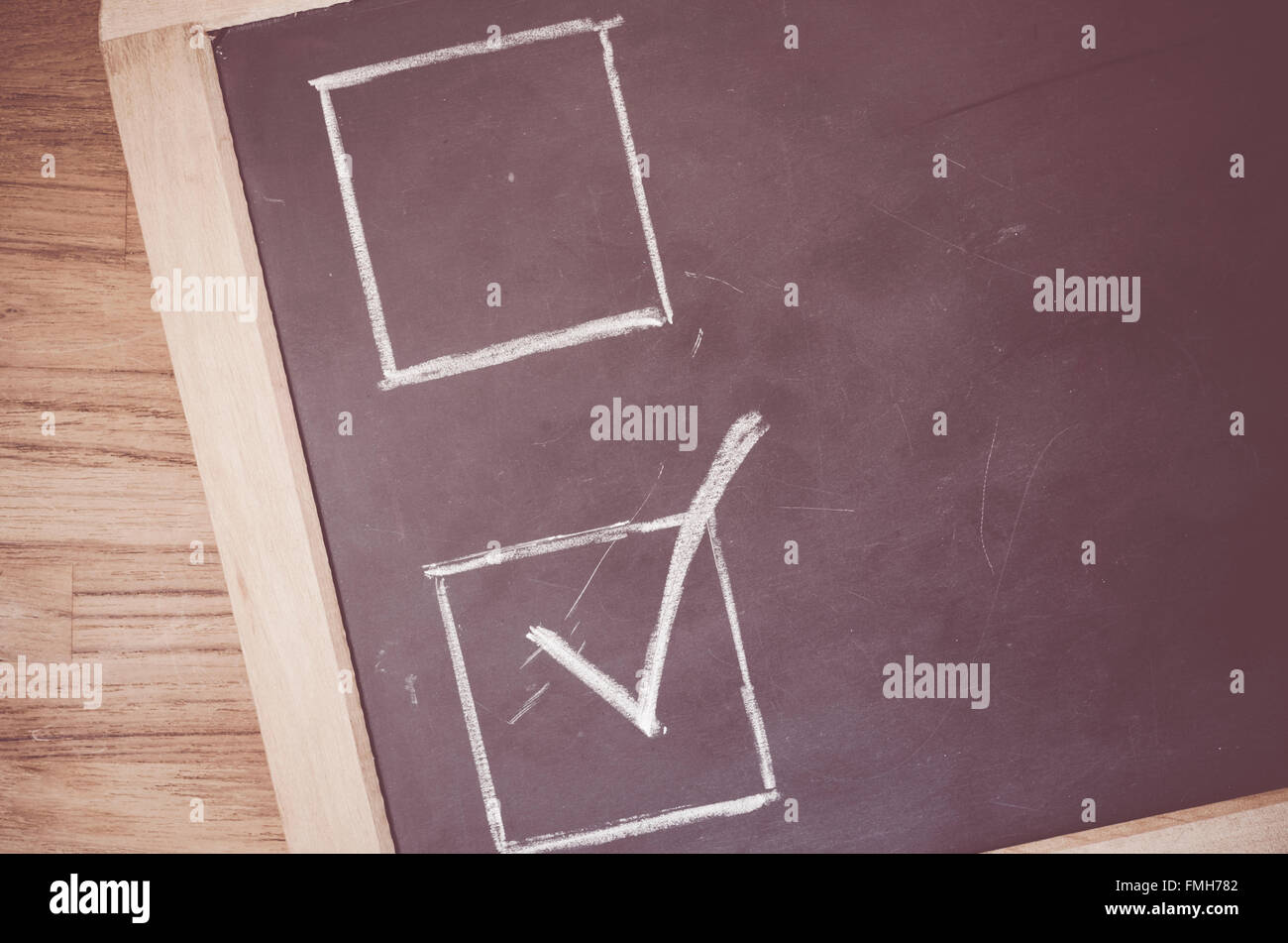 check boxes and text on a blackboard surface Stock Photo - Alamy