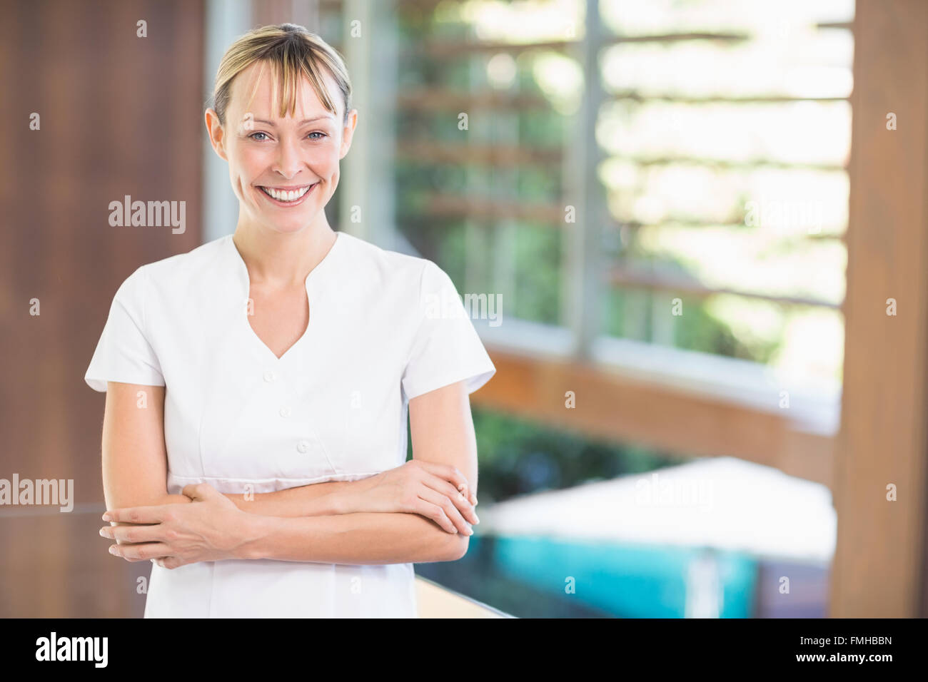 Happy female masseur standing hi-res stock photography and images - Alamy