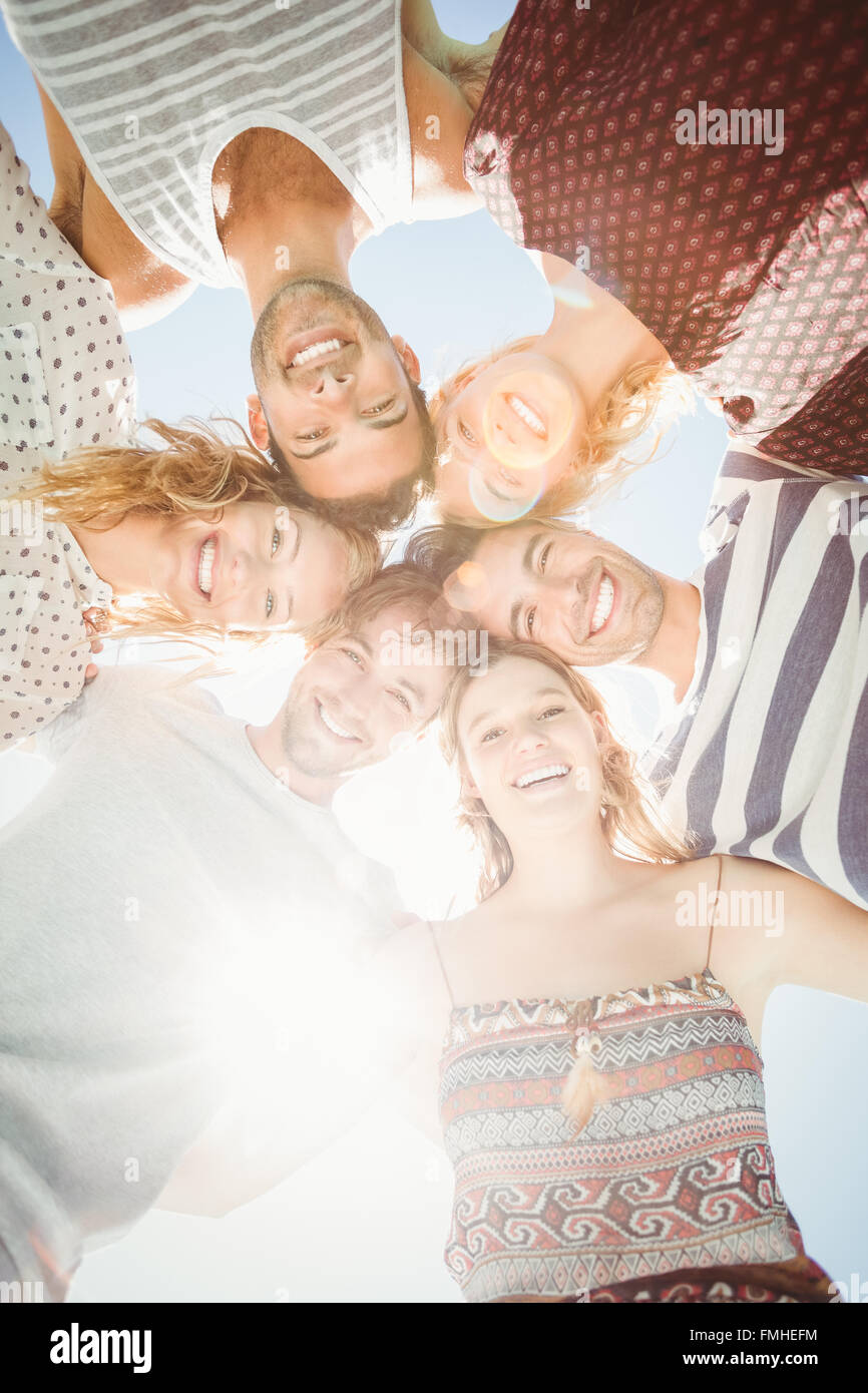Group of friends forming a huddle Stock Photo - Alamy