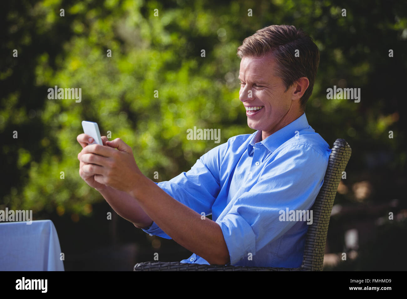 Handsome businessman texting Stock Photo - Alamy