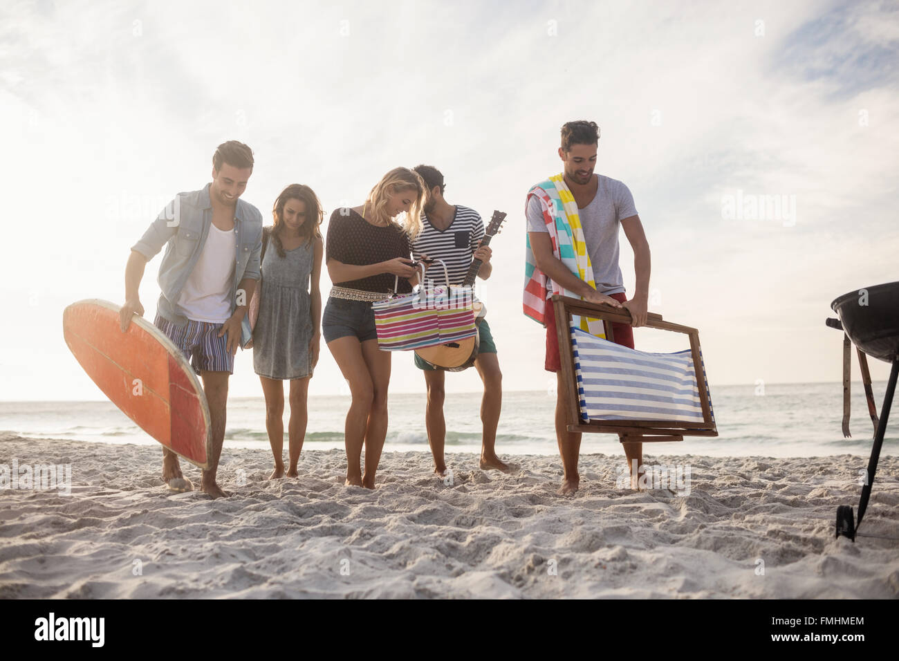 Happy friends bringing their stuff Stock Photo - Alamy