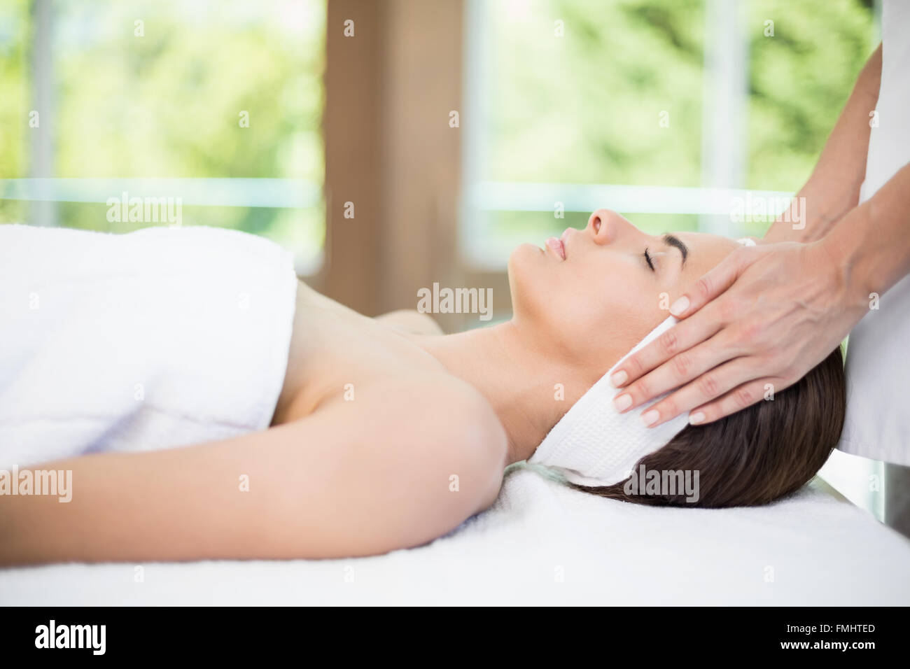 Side view of woman receiving massage Stock Photo - Alamy