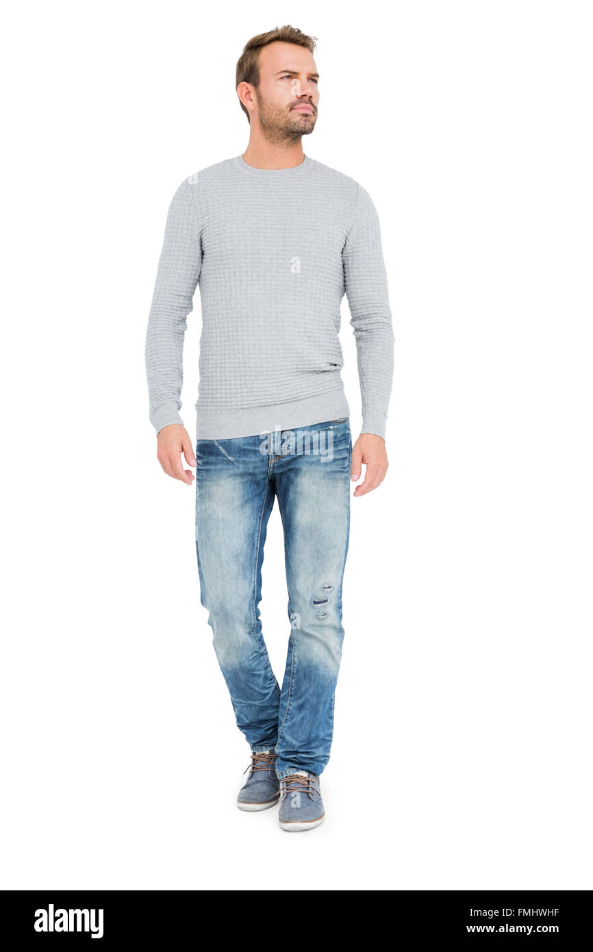 Young man standing and looking away Stock Photo - Alamy