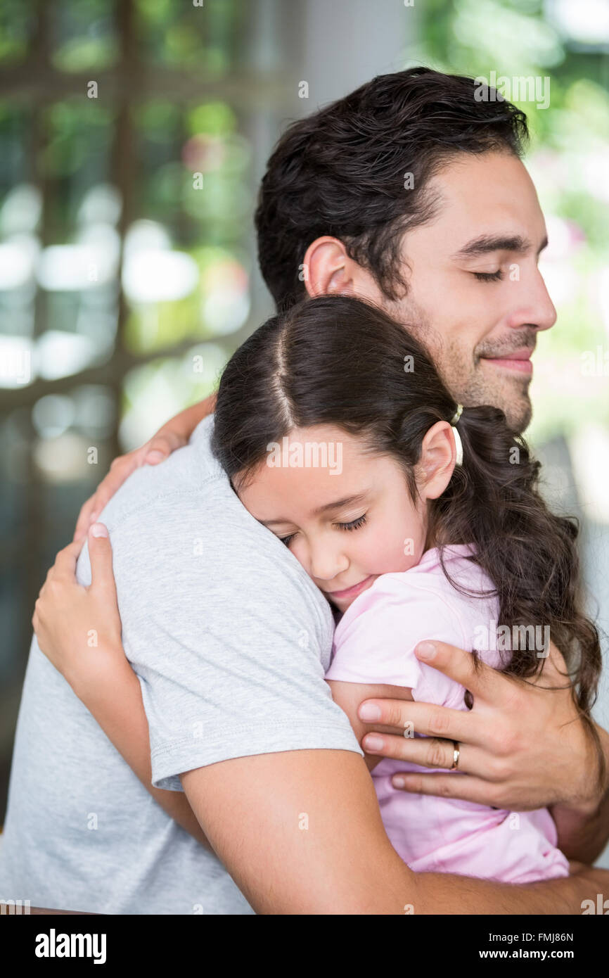 Daughter hugging father Stock Photo - Alamy