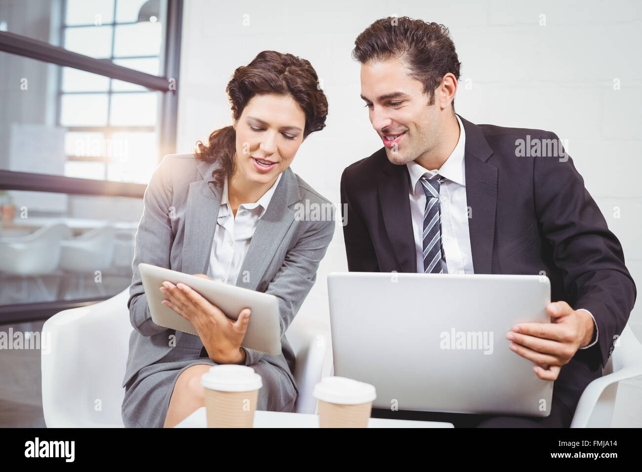 Business people with technology Stock Photo - Alamy