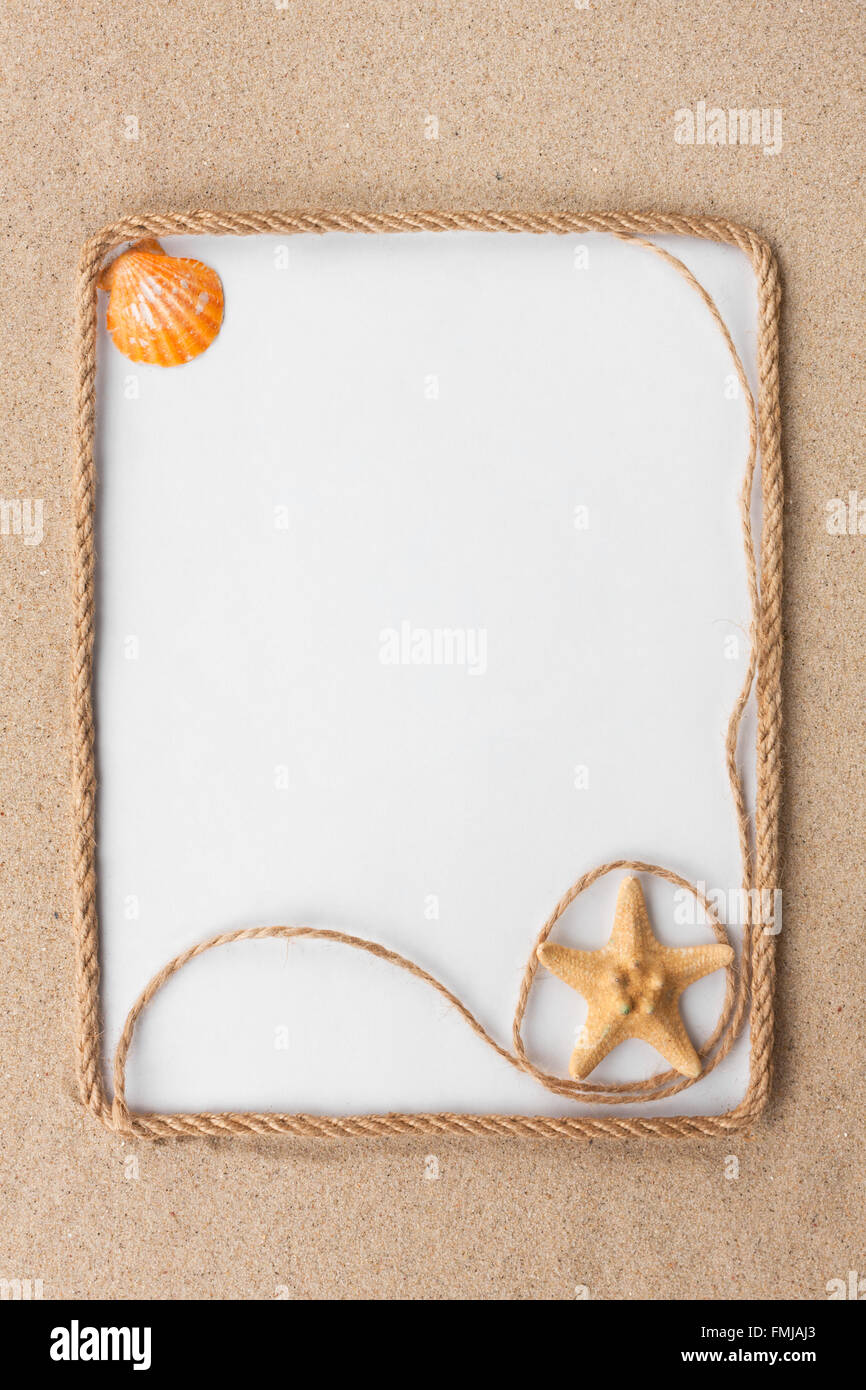 Beautiful frame of rope and star and sea shells with a white background ...