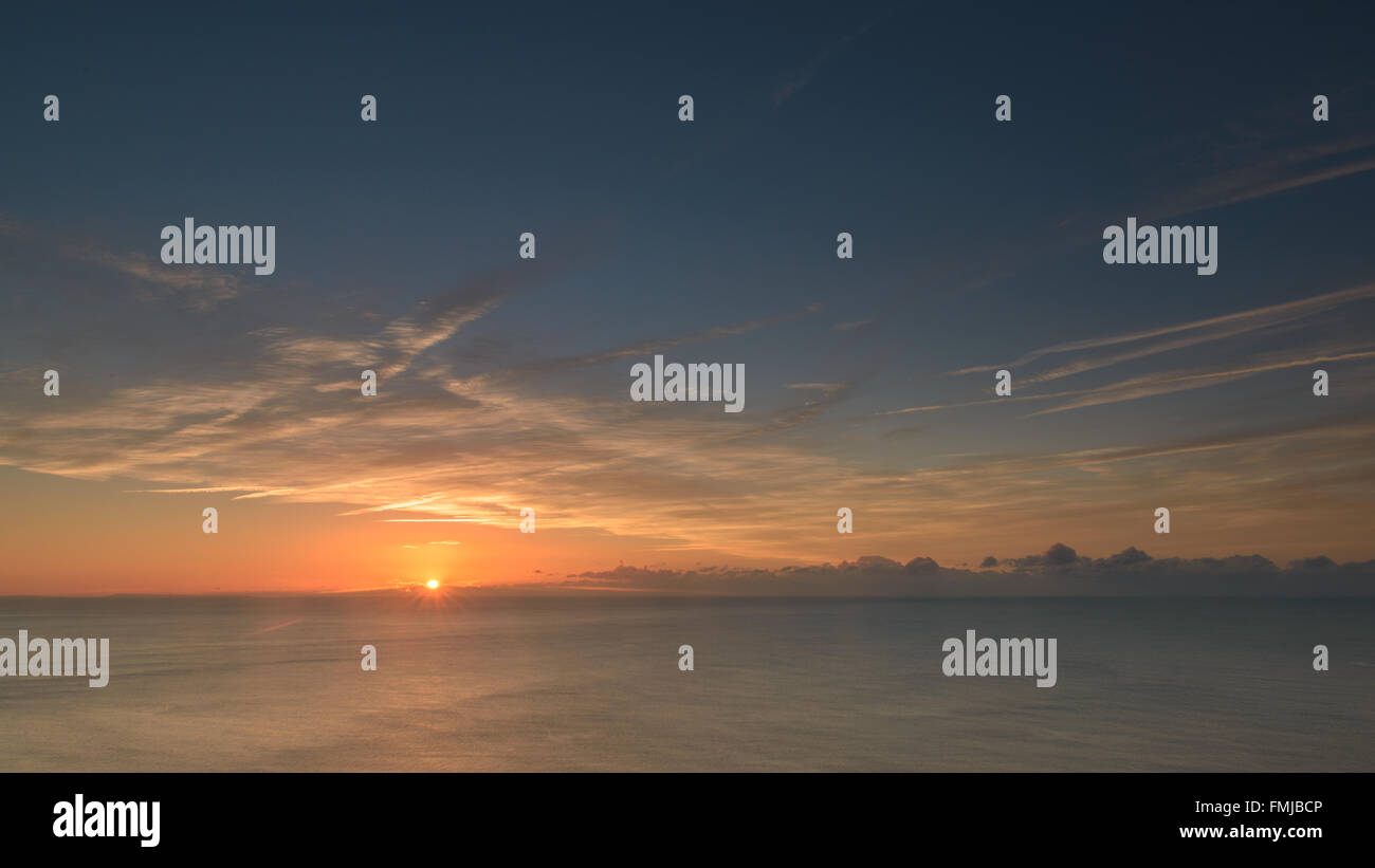 Sunrise over ocean low hi-res stock photography and images - Alamy