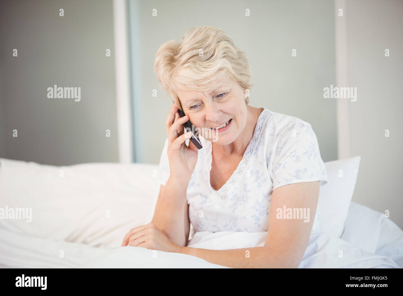 Senior woman talking on phone Stock Photo - Alamy