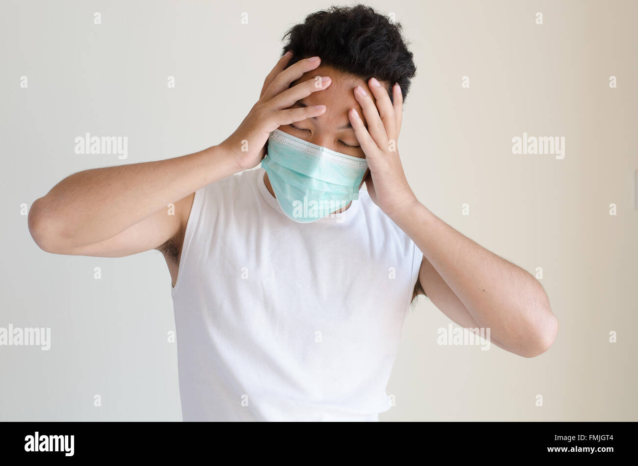 Asian man wearing a face mask Stock Photo - Alamy