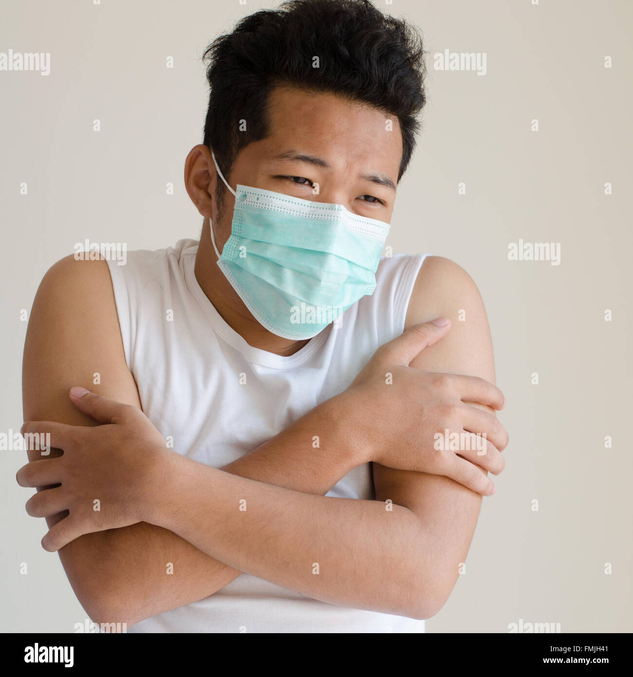Asian man wearing a face mask Stock Photo - Alamy
