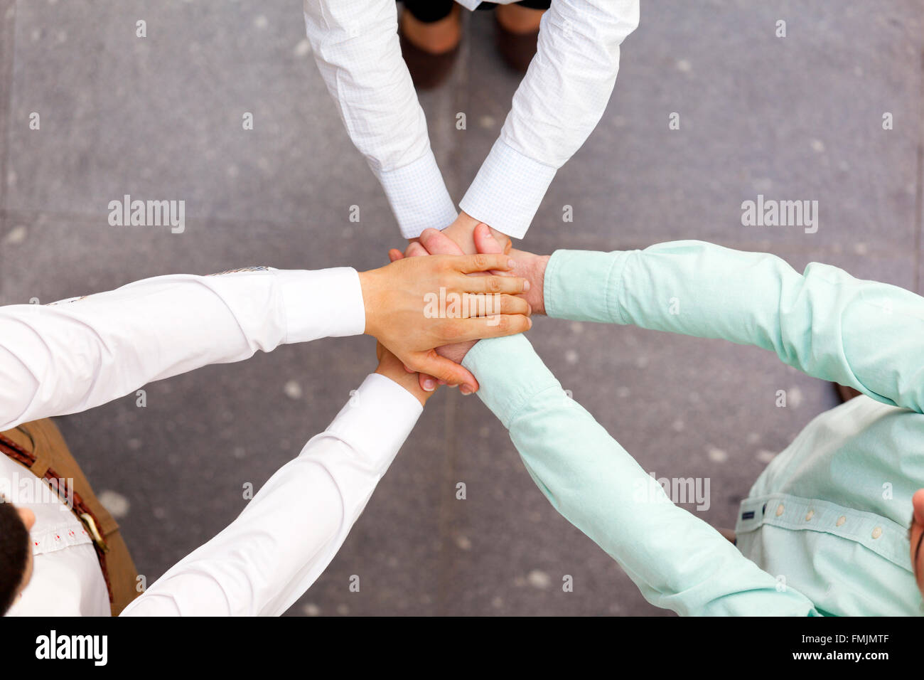 Top view of teamwork handshake Stock Photo - Alamy