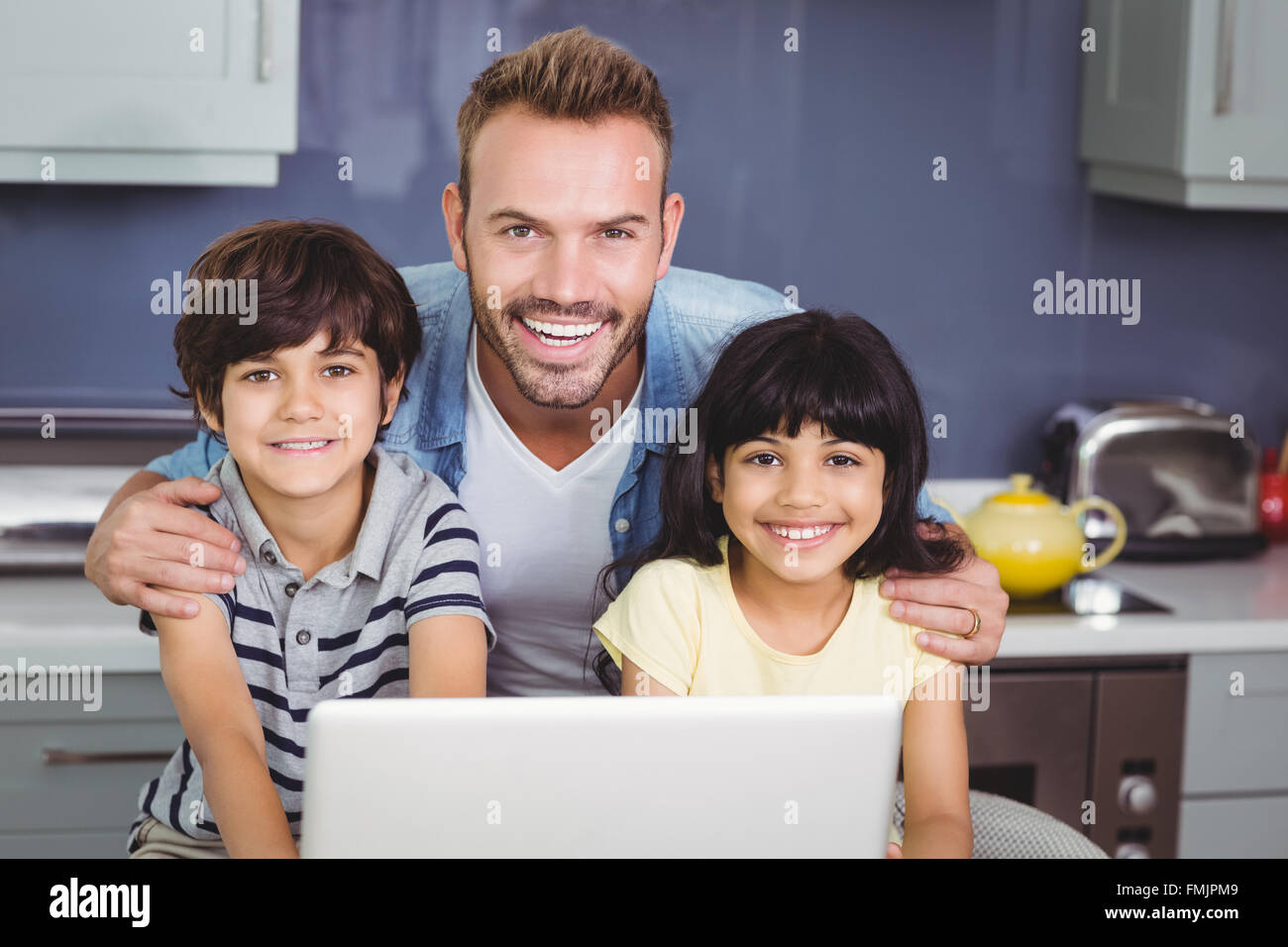 Portrait of smiling father with children Stock Photo - Alamy
