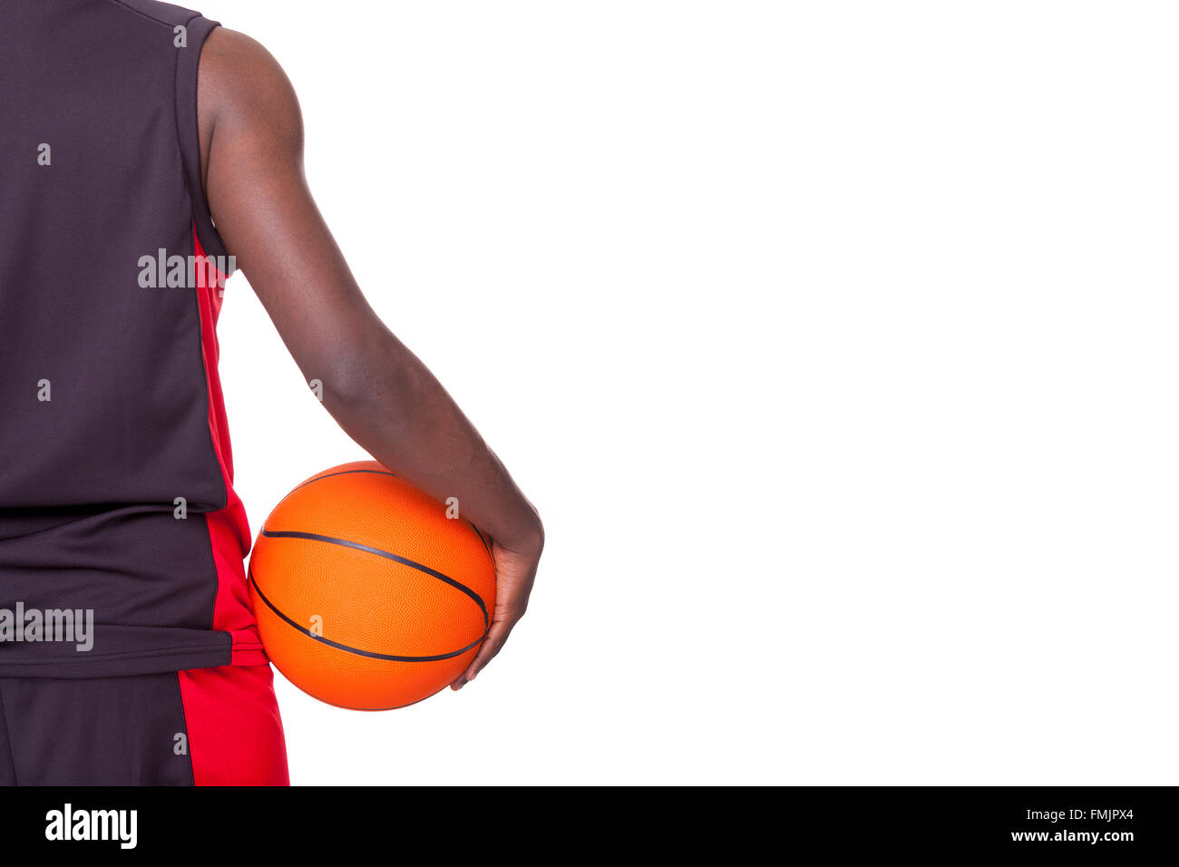 Back view of a basketball player holding a ball, isolated on white ...