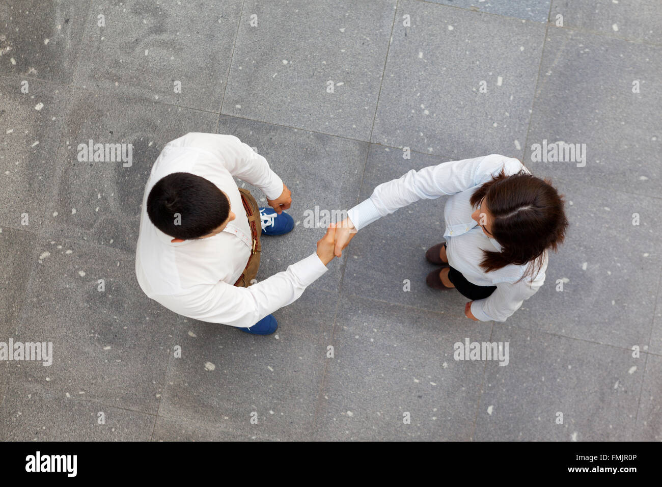 Top view of businesspeople shaking hands outdoors Stock Photo - Alamy
