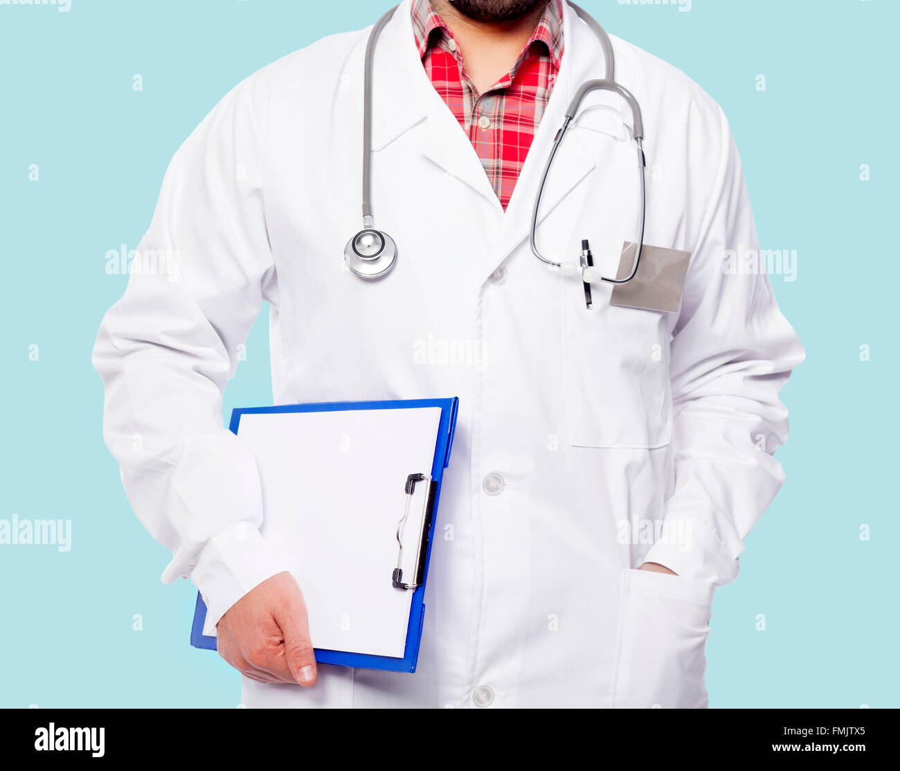 Male doctor in a blue background Stock Photo - Alamy