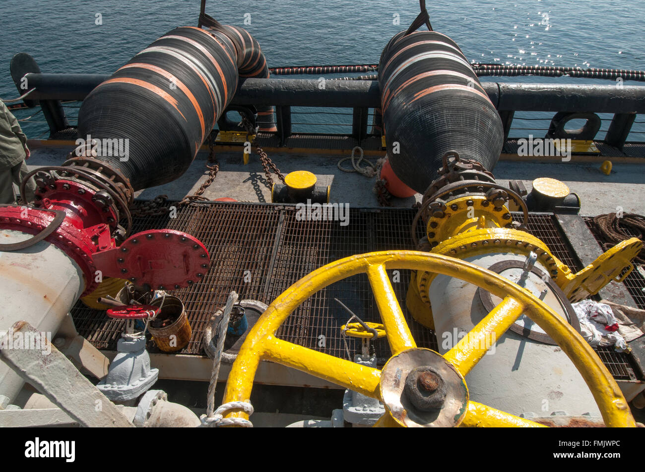 Oil tanker is transferring oil to the cargo vessel Stock Photo - Alamy