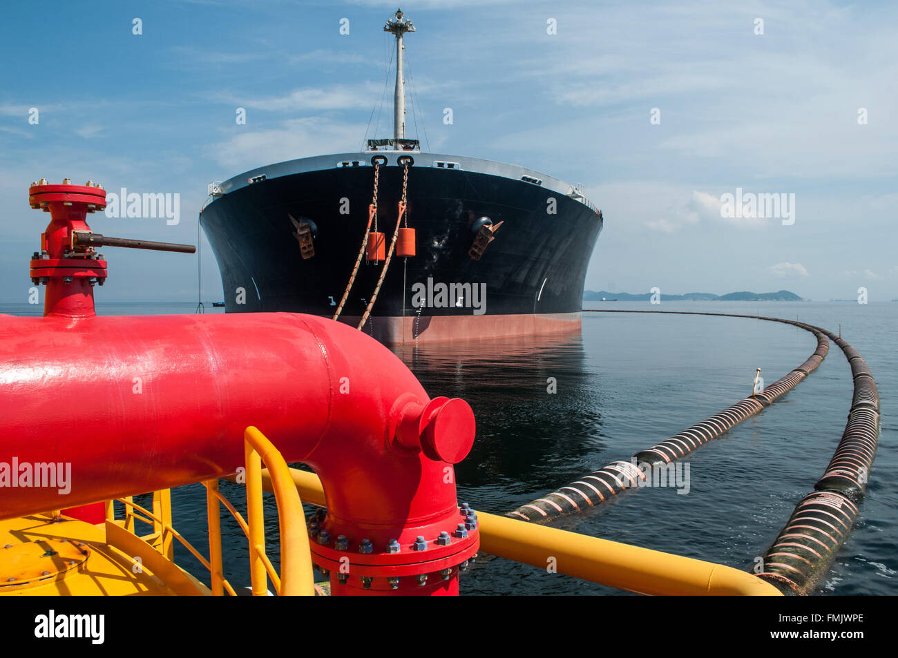 Oil tanker is transferring oil to the cargo vessel Stock Photo - Alamy