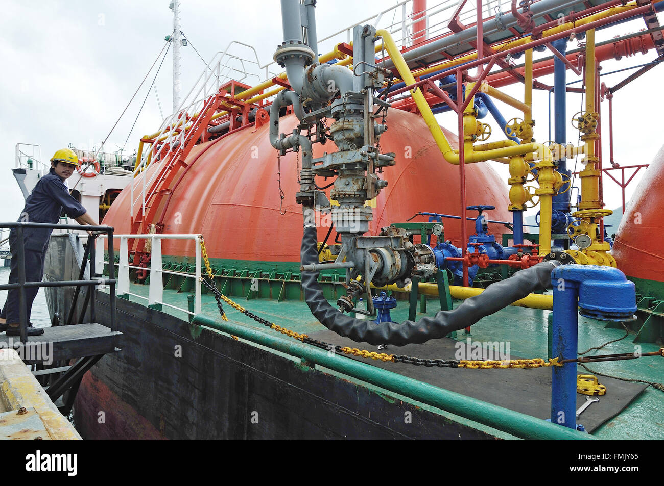 CHONBURI - OCTOBER 3: Workers preparing for loading crude oil form ship ...