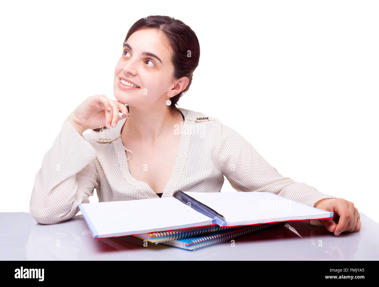 Pensive female student looking up, isolated on white background Stock ...
