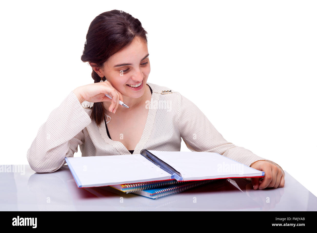 Female student studying at the desk, isolated on white background Stock ...
