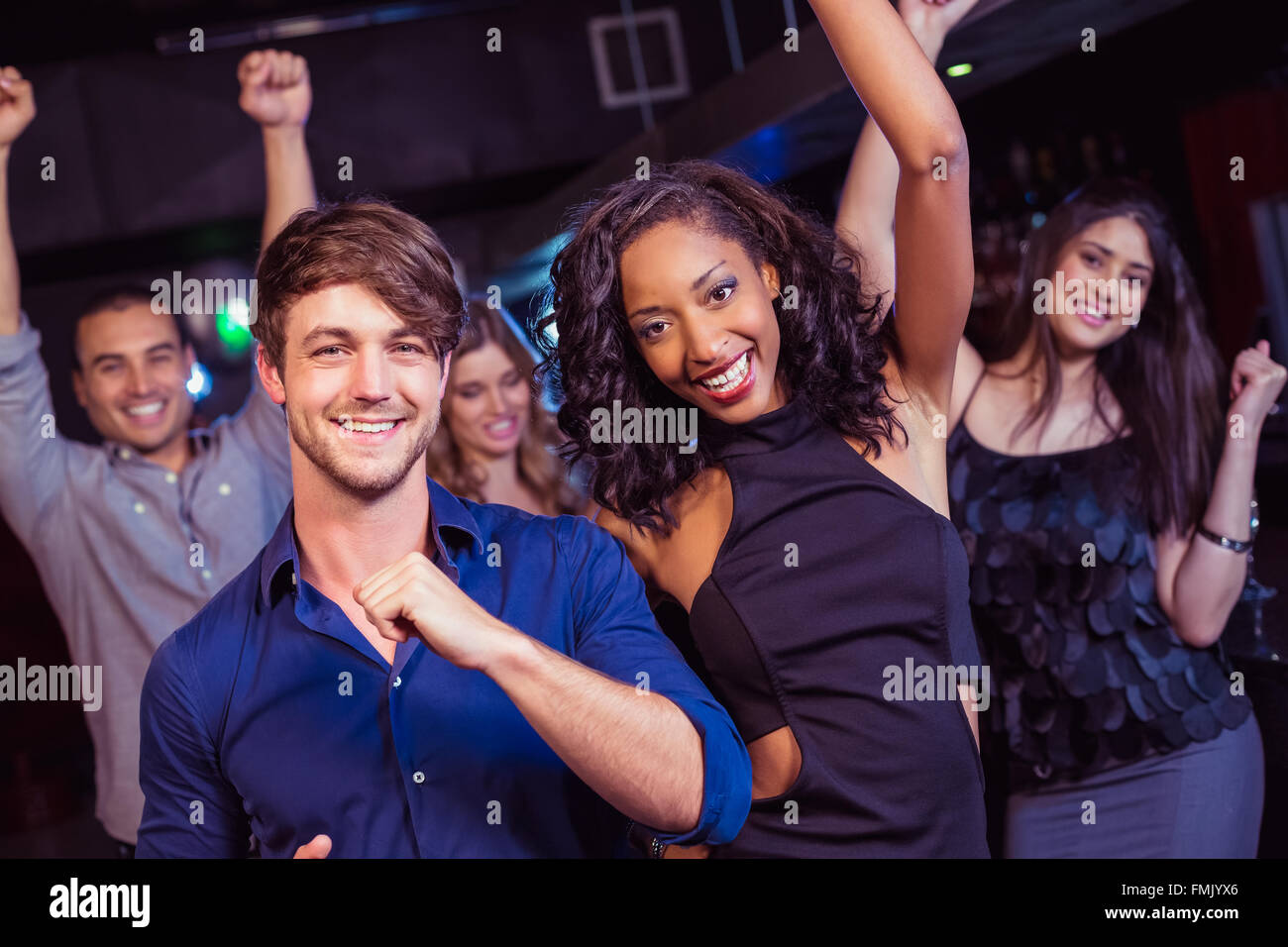 Happy friends dancing together Stock Photo - Alamy
