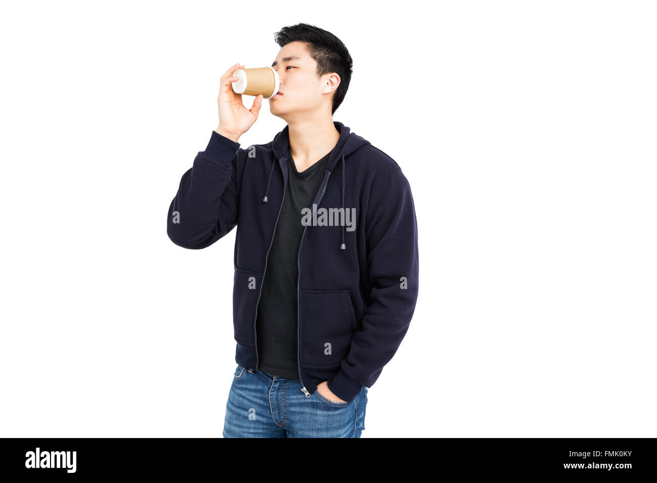 Young man having coffee Stock Photo - Alamy