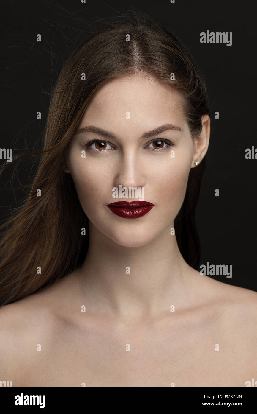 Beauty and fashion model on the black background. Studio portrait Stock ...