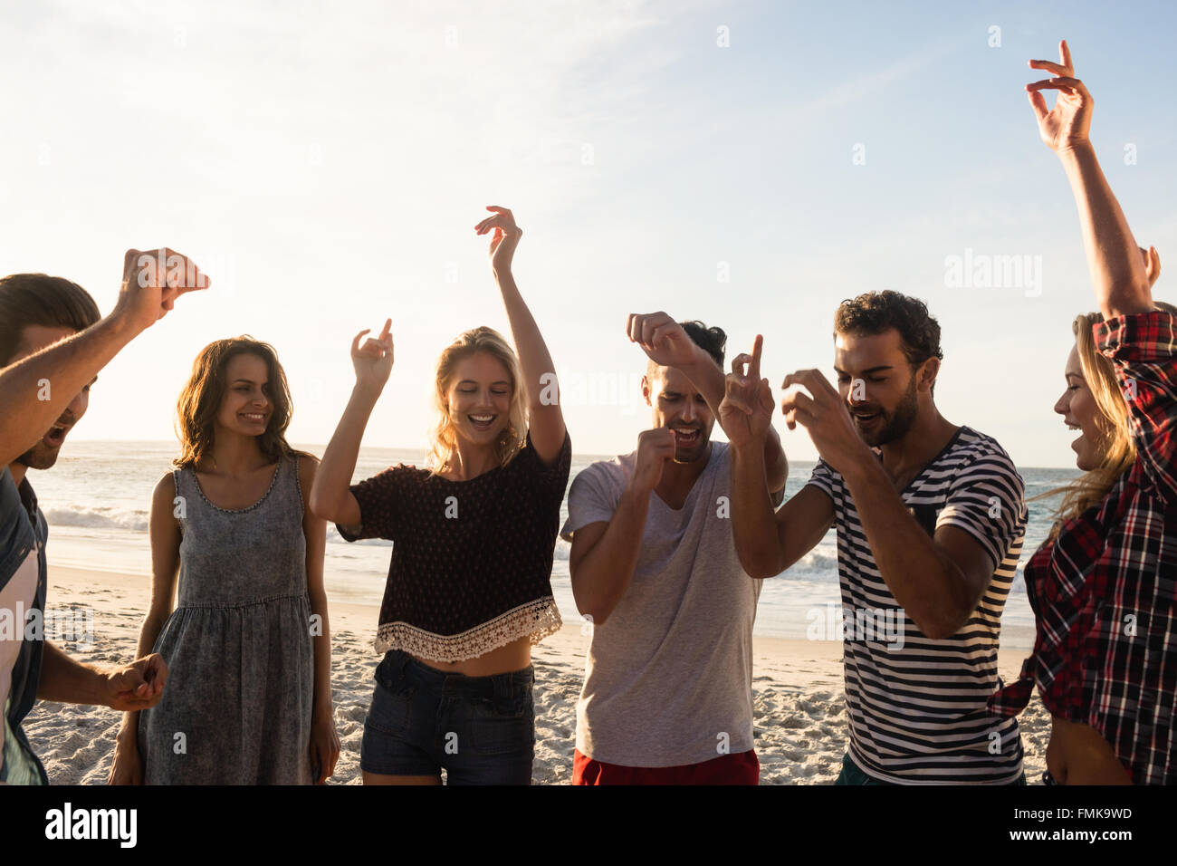 Happy friends dancing together Stock Photo - Alamy