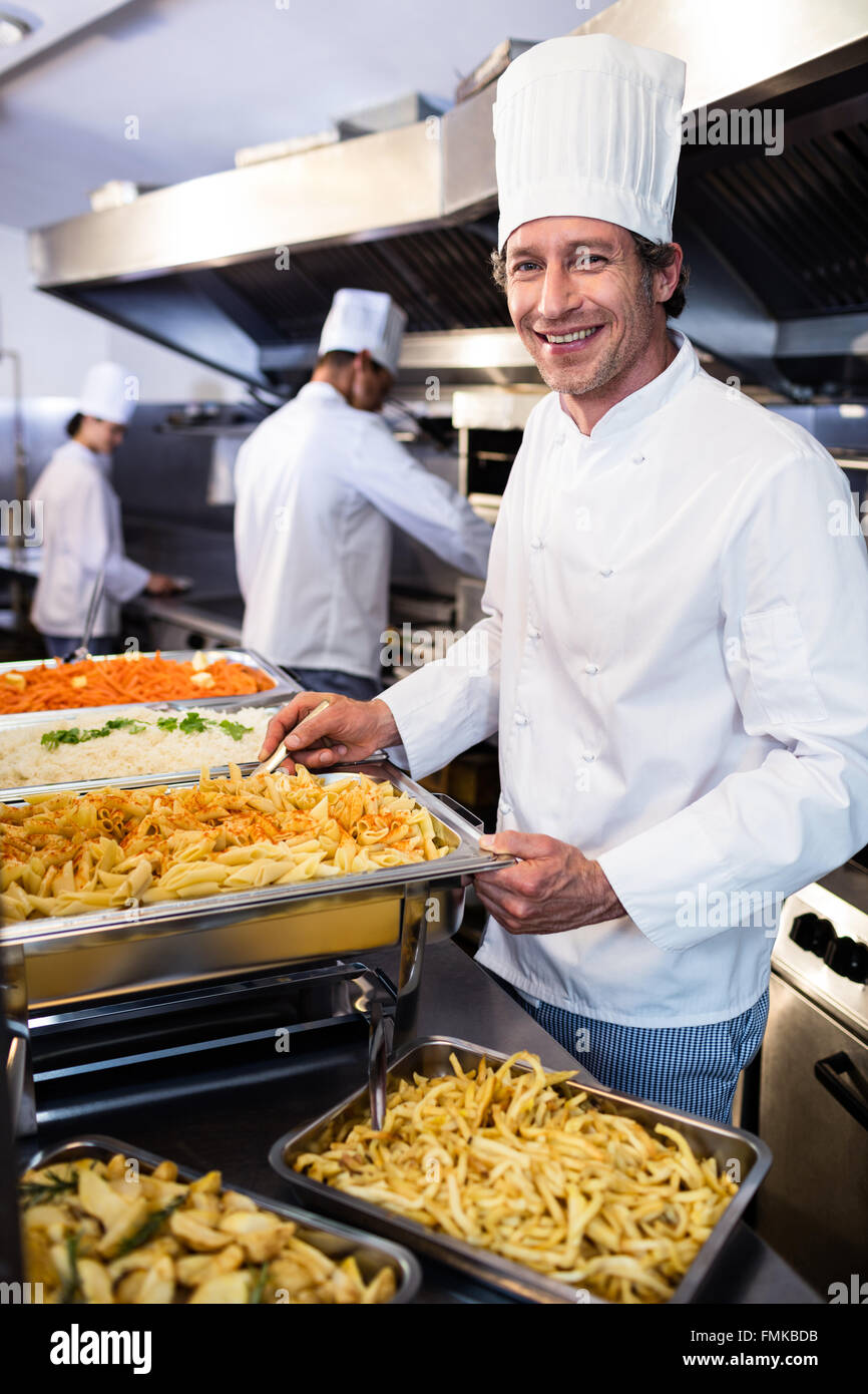Chef standing at serving trays of pasta Stock Photo - Alamy