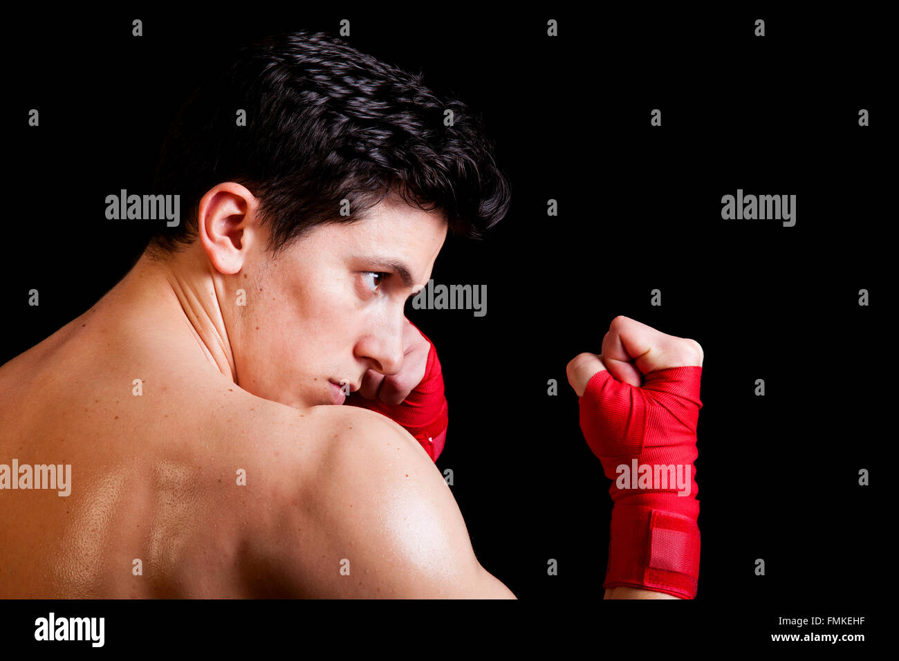 Young Boxer fighter over black background Stock Photo - Alamy