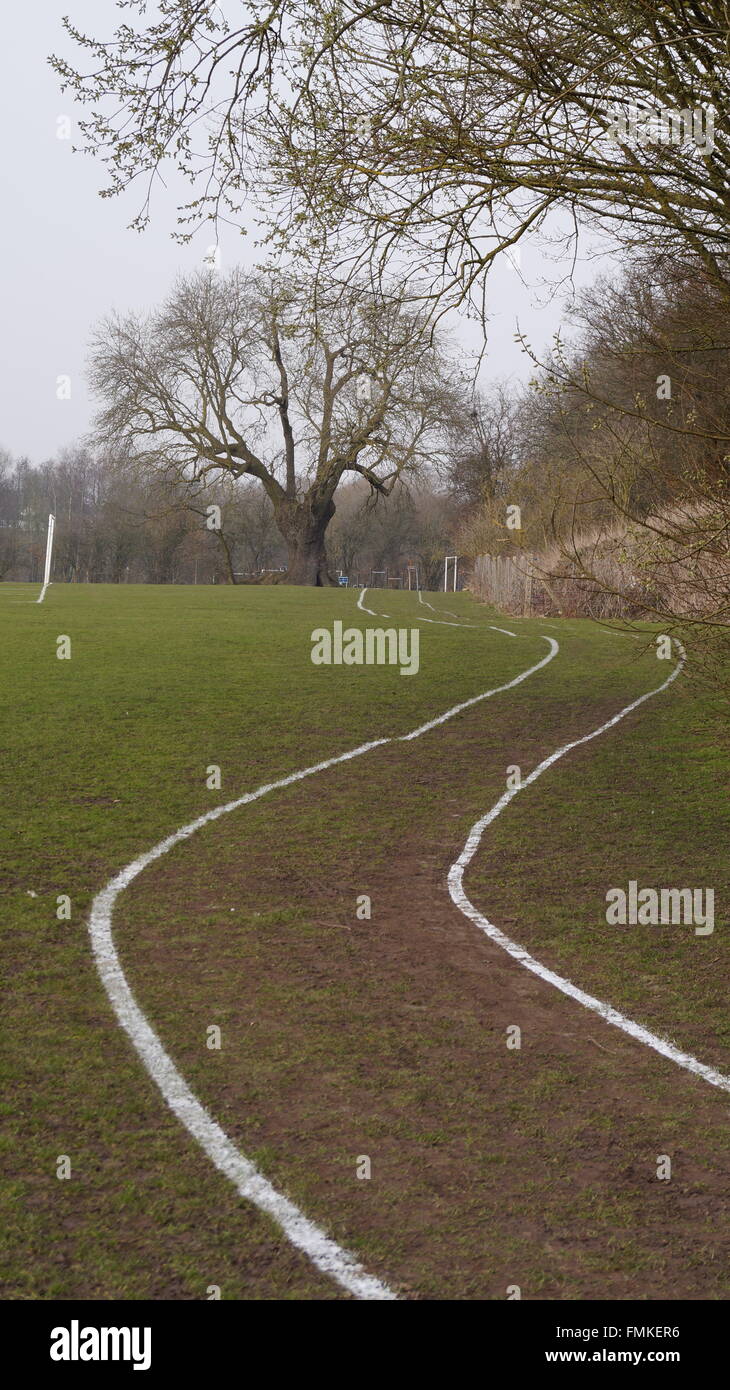 Running track marked out on a field Stock Photo - Alamy