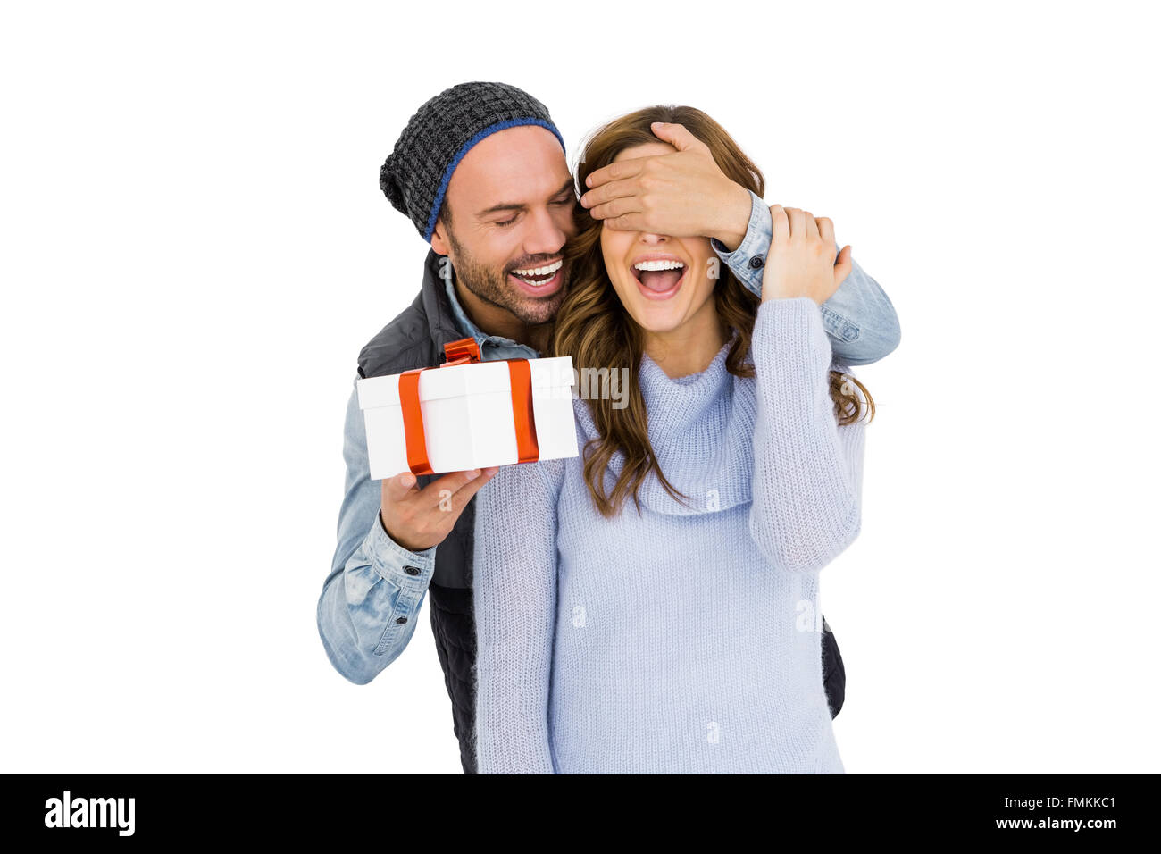 Man giving a surprise gift to woman Stock Photo - Alamy